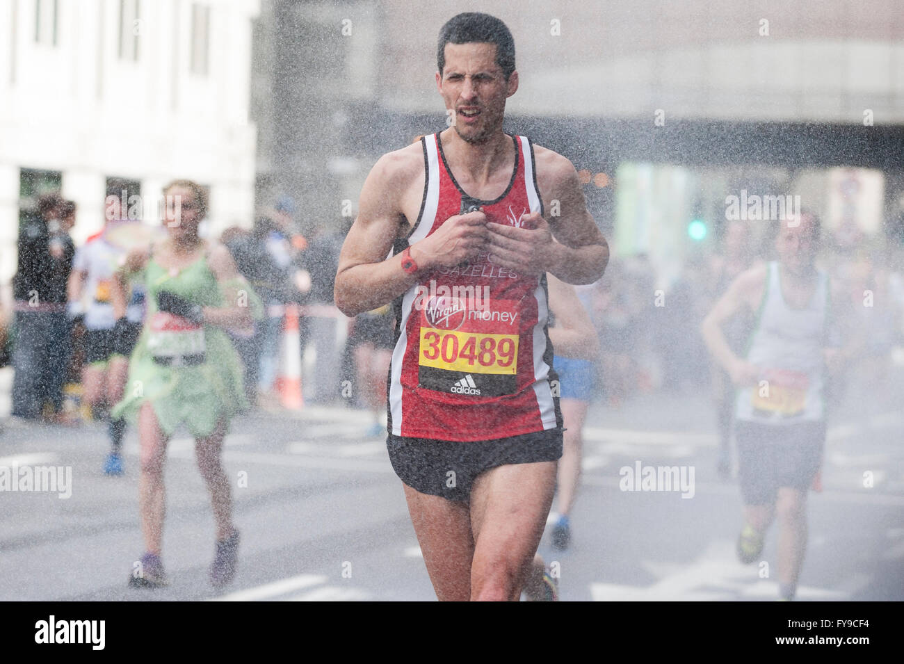 London, UK. 24 April 2016. Tired runners in the Virgin Money London ...