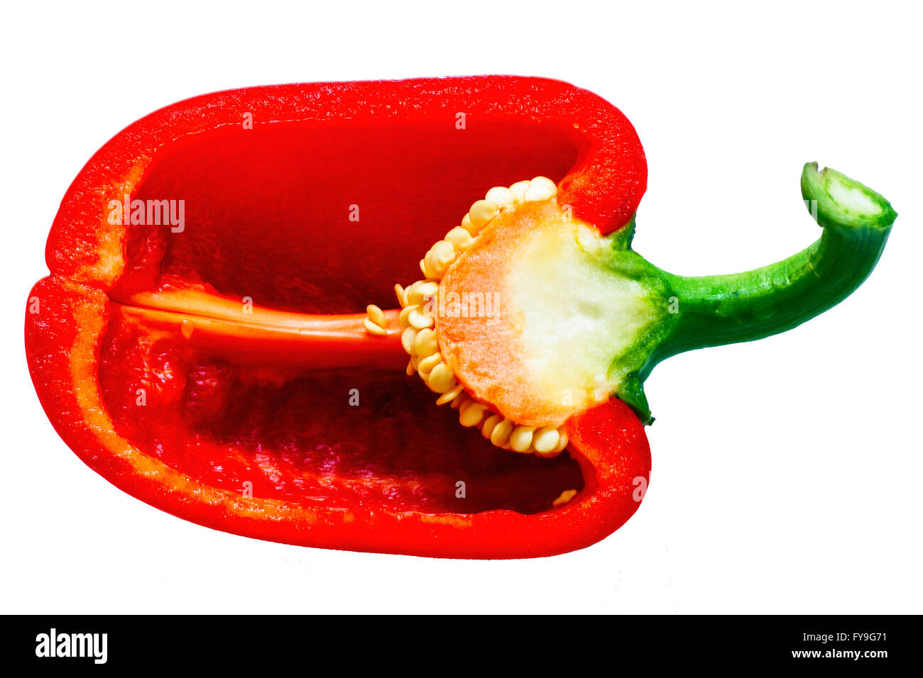 Cut half of a red pepper on a white background Stock Photo - Alamy