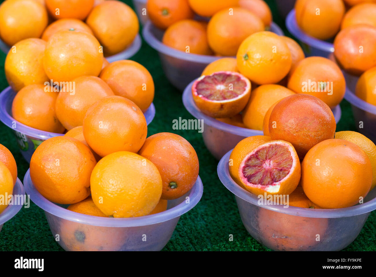 Market stall selling blood oranges in plastic bowls Stock Photo - Alamy