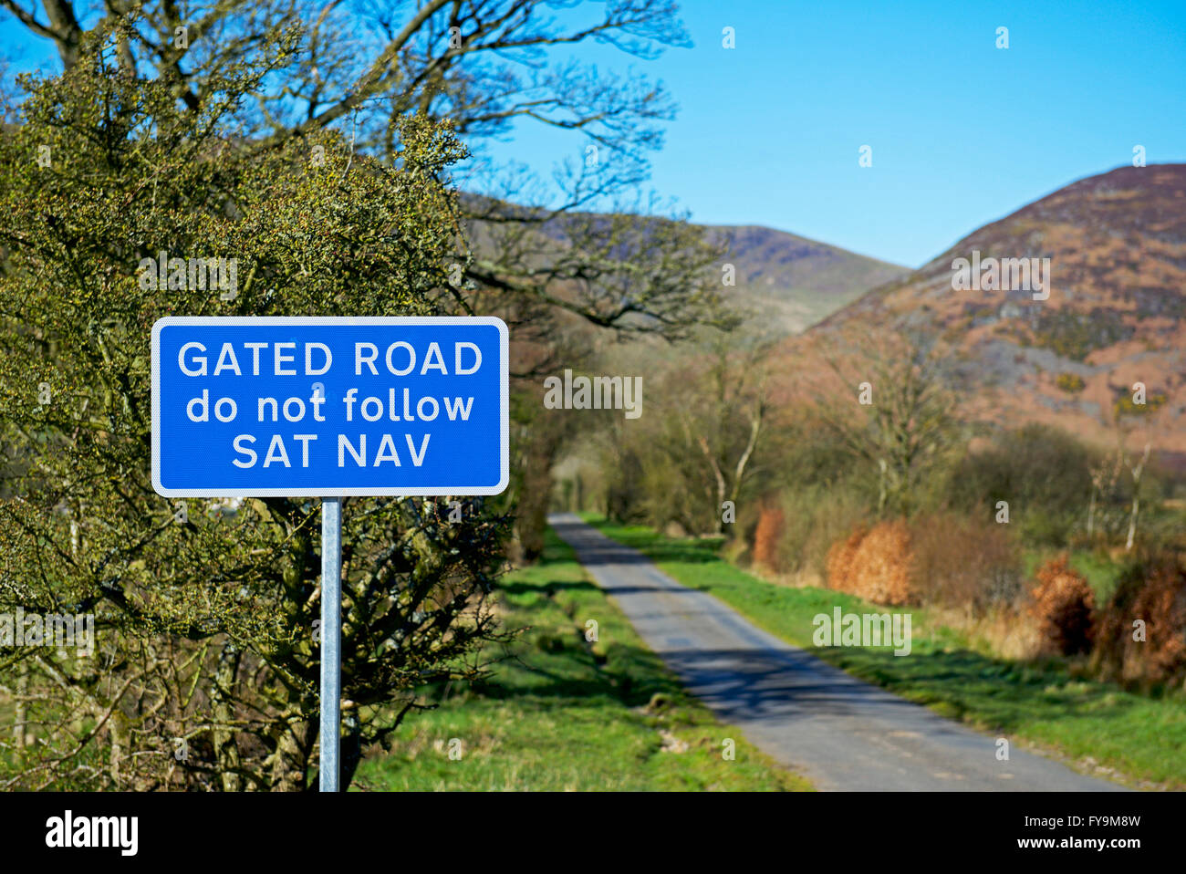 Sign: Gated road, do not follow satnav, Cumbria, England UK Stock Photo ...