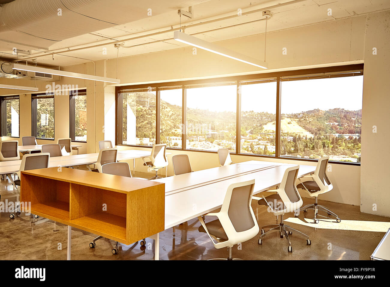 Modern office with windows and city view Stock Photo - Alamy