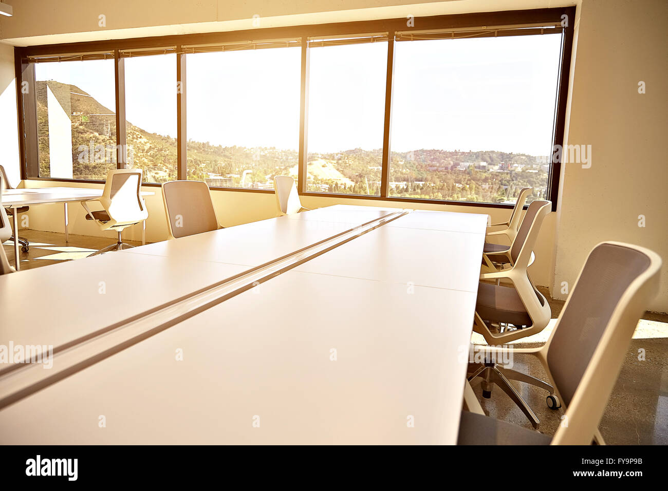 Modern office with windows and city view Stock Photo - Alamy