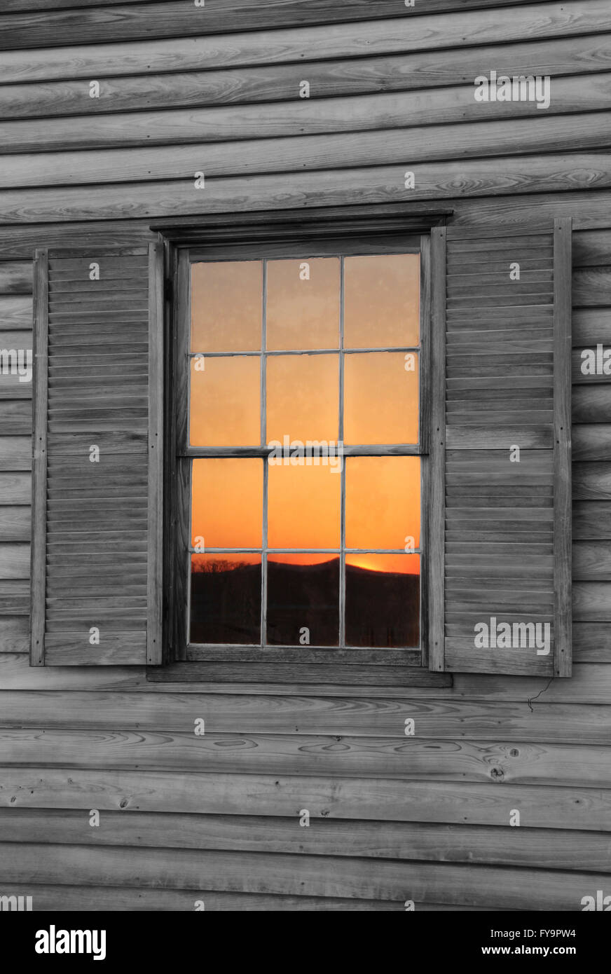 Color splash sunset reflected in window of a wooden house Stock Photo ...