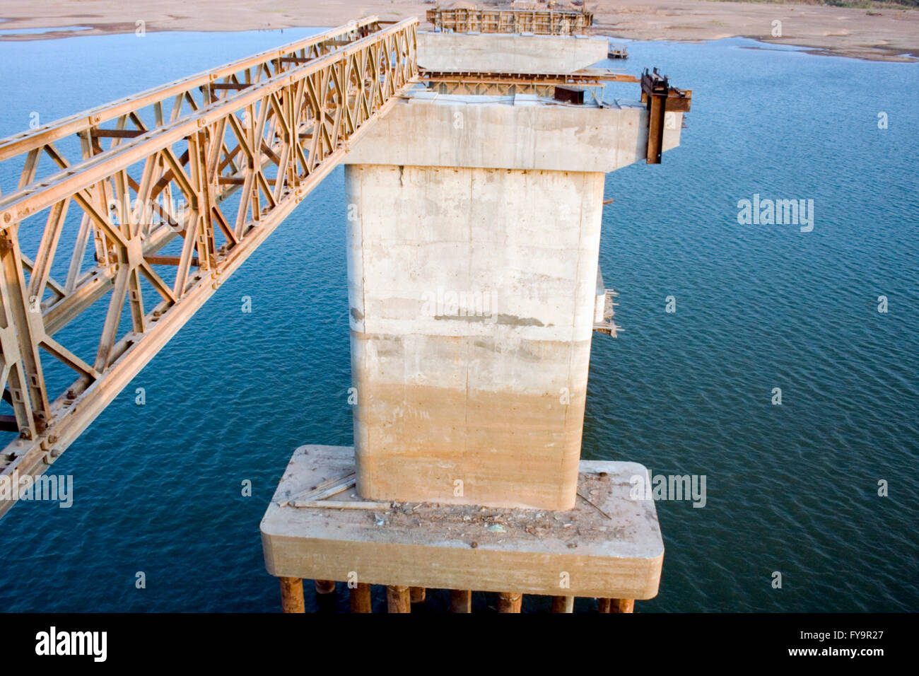 A new steel & concrete bridge is being built to replace a bamboo bridge ...