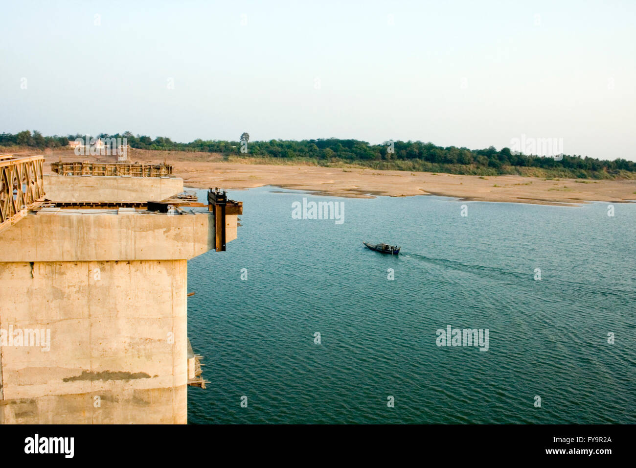 A new bridge is being built to replace a bamboo bridge that crosses the ...