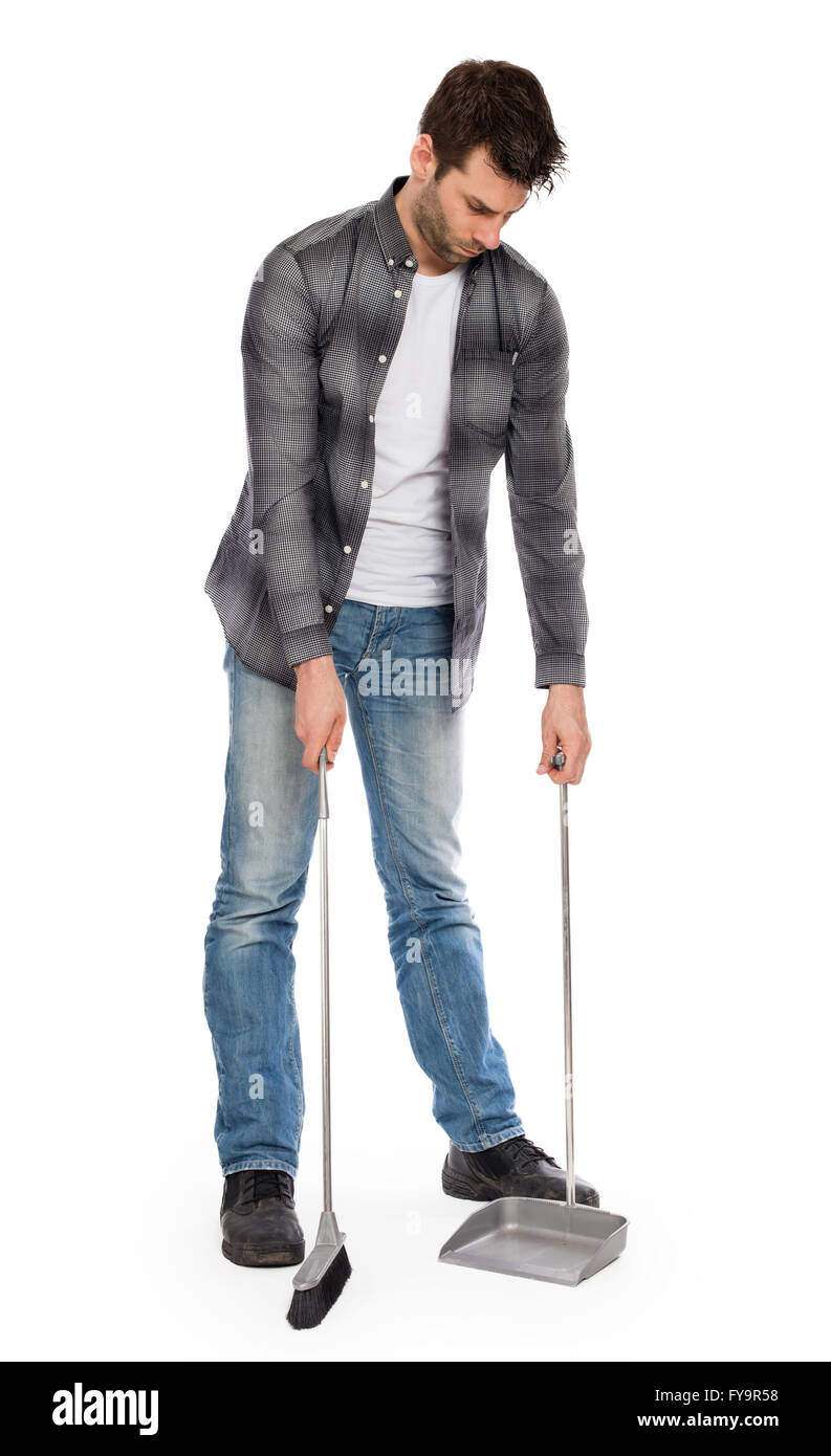 Full isolated studio picture from a young worker with a broom Stock ...
