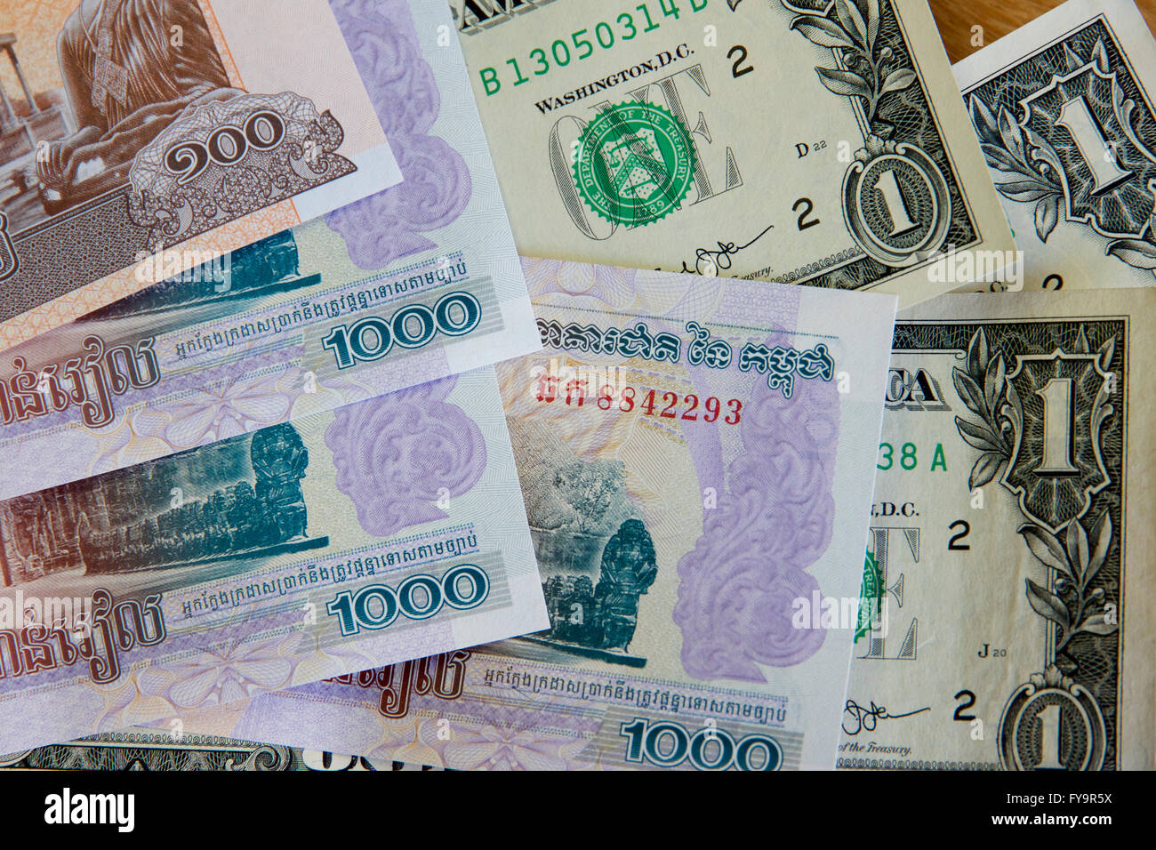 Cambodian riel and American dollars: currency of Cambodia Stock Photo ...