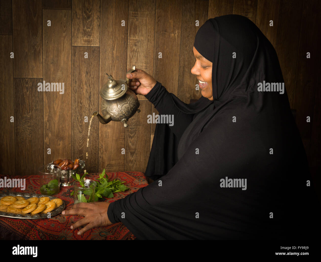Woman pouring mint tea hi-res stock photography and images - Alamy