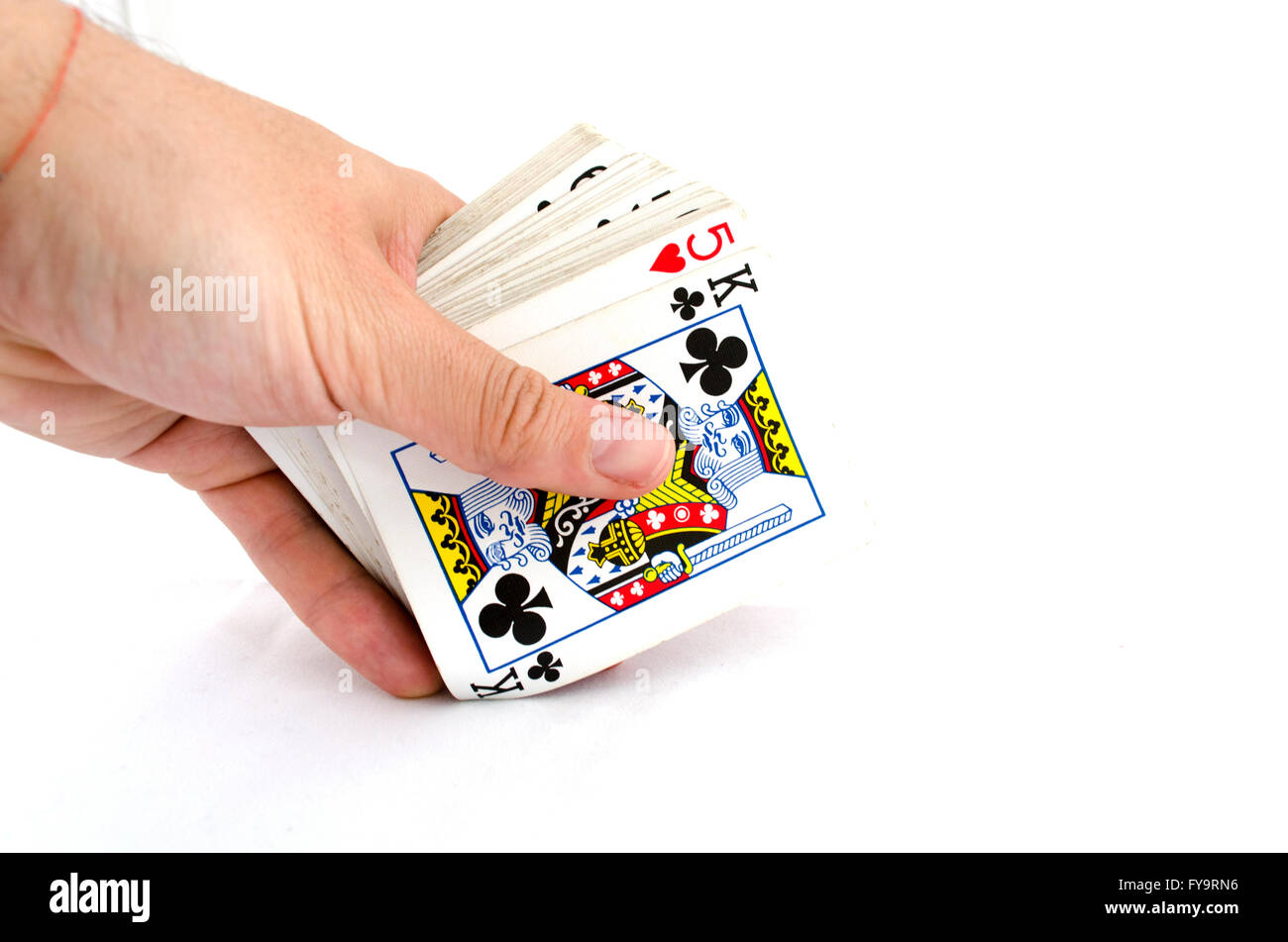 Playing cards in hand isolated on white background Stock Photo - Alamy