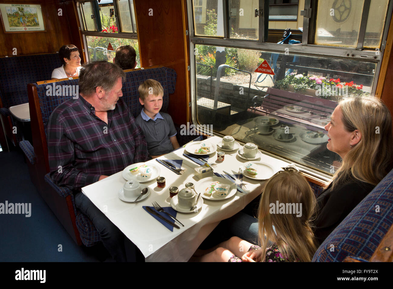UK, Kent, Tenterden, Kent & East Sussex Railway German family enjoying ...