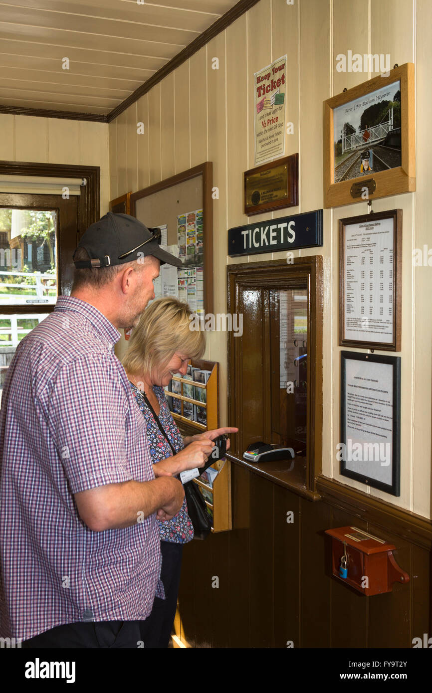 UK, East Sussex, Bodiam, Kent & East Sussex Railway, couple buying ...