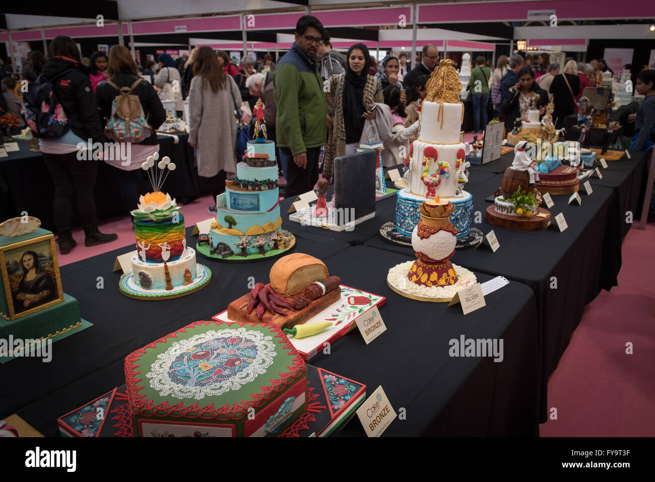 People looking at decorative wedding cakes at Cake International – The ...