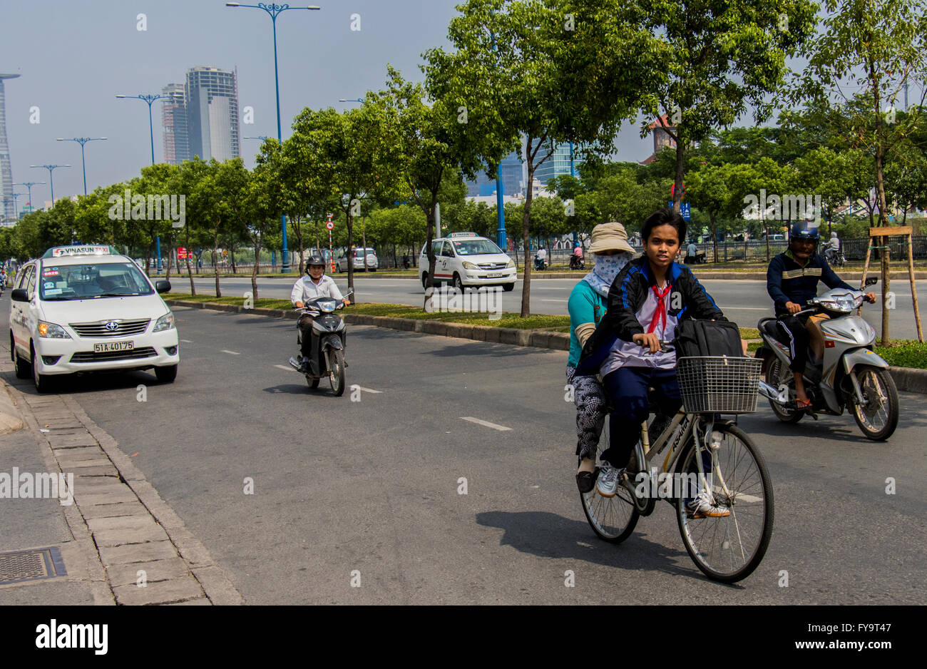 Cyclist on road in Ho Chi Minh city Vietnam Stock Photo - Alamy