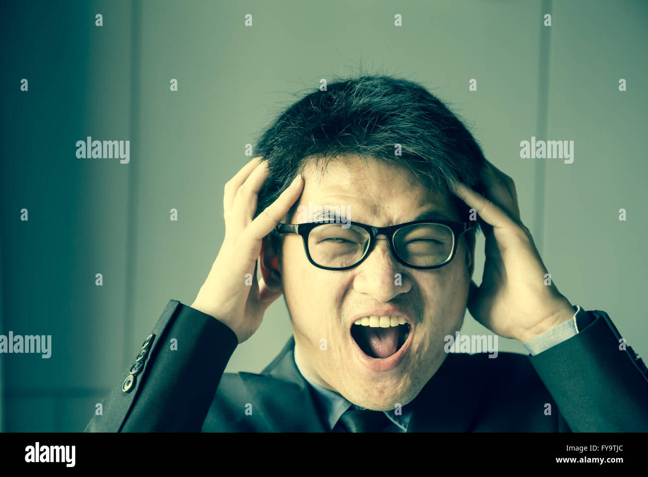 Young asian man shouting Stock Photo - Alamy