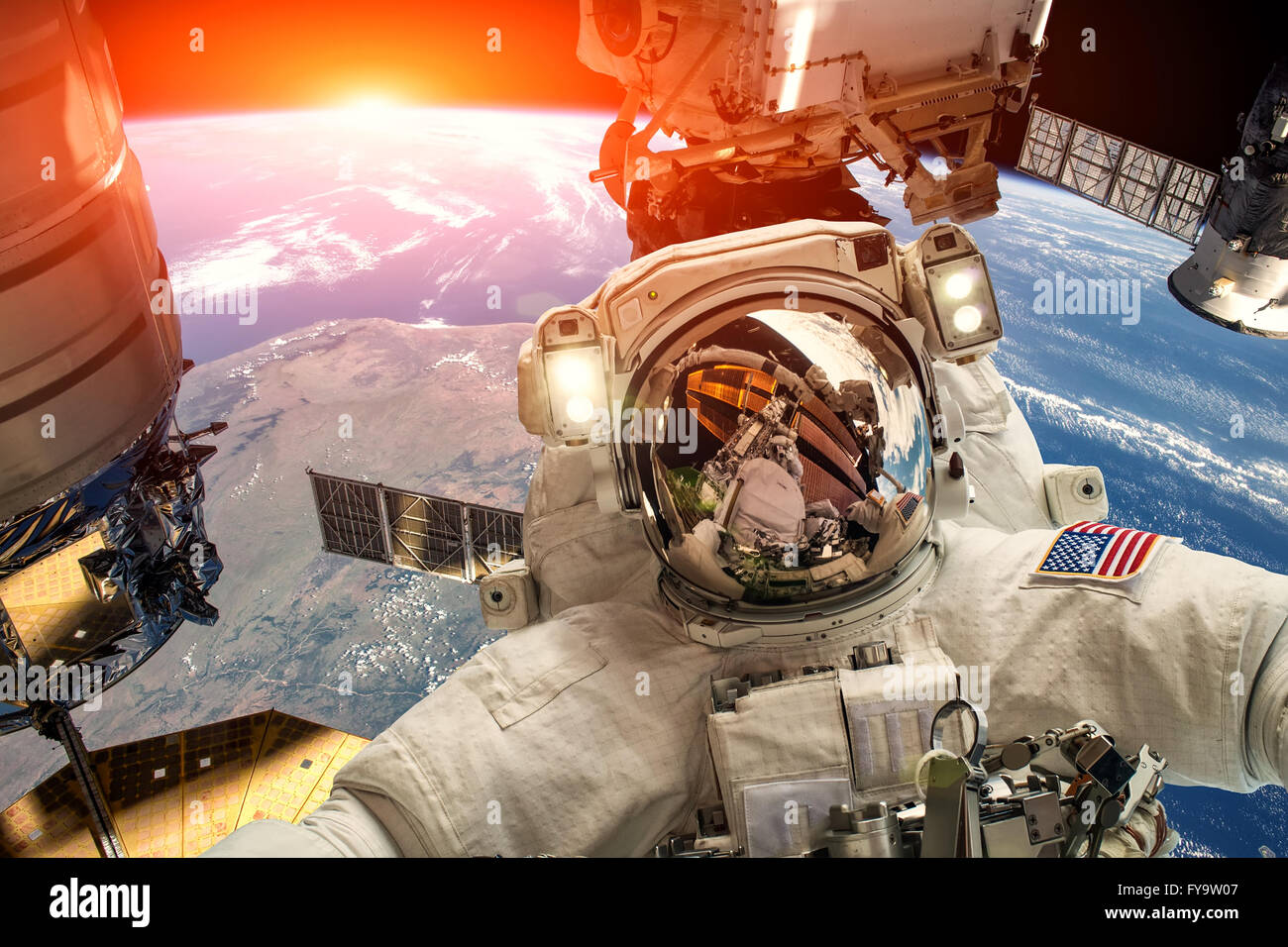 International Space Station and astronaut in outer space over the planet Earth. Elements of this ...