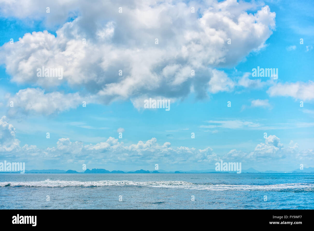 beautiful tropical blue ocean and clouds on sky with wave foam, travel ...