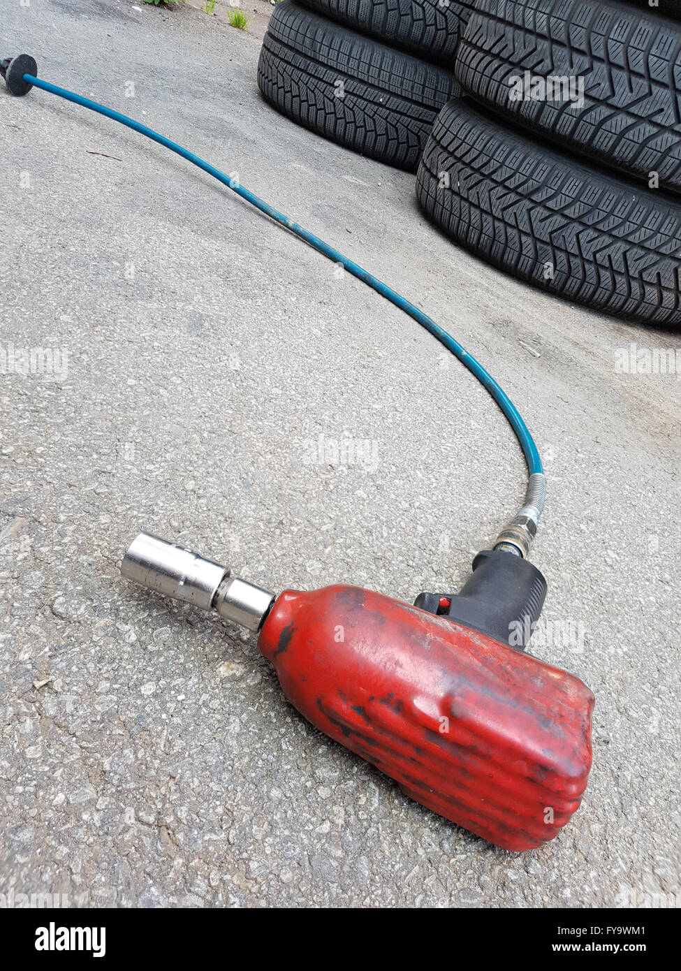 Air gun and tire mechanic background Stock Photo - Alamy