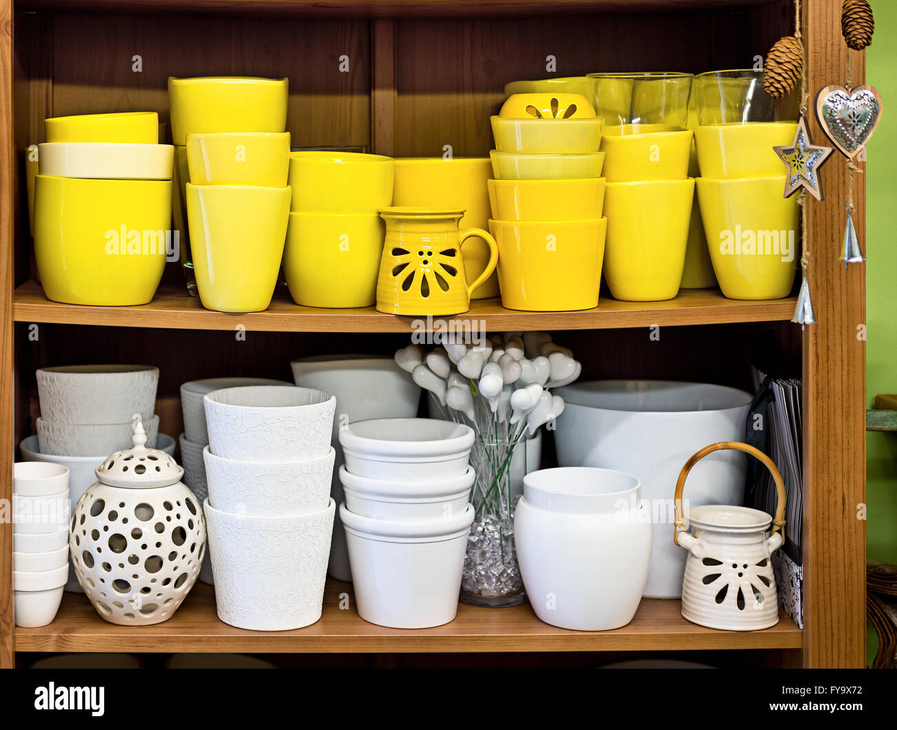 new ceramic flowerpots in the florist store Stock Photo - Alamy