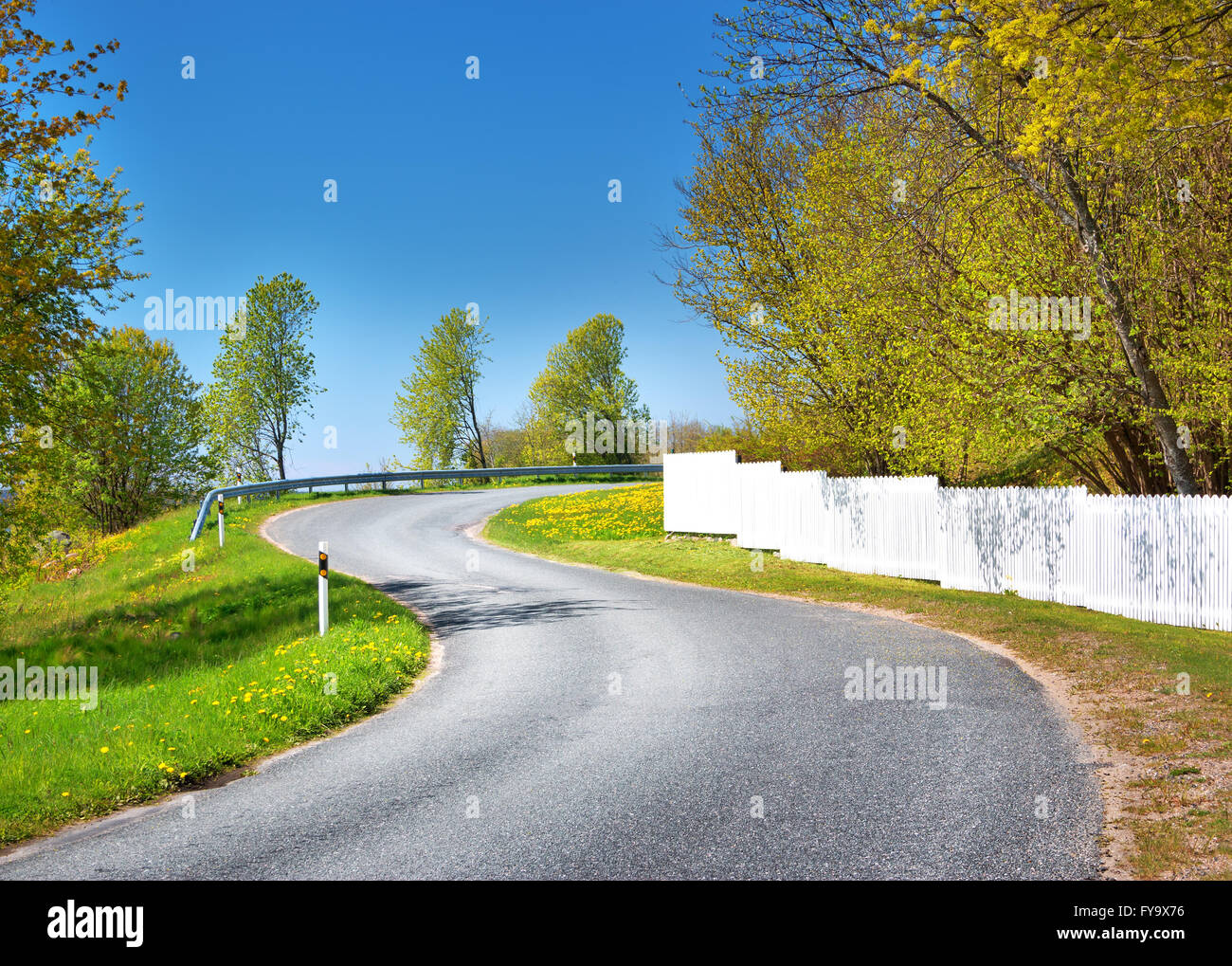 Car on asphalt road in beautiful spring day Stock Photo - Alamy