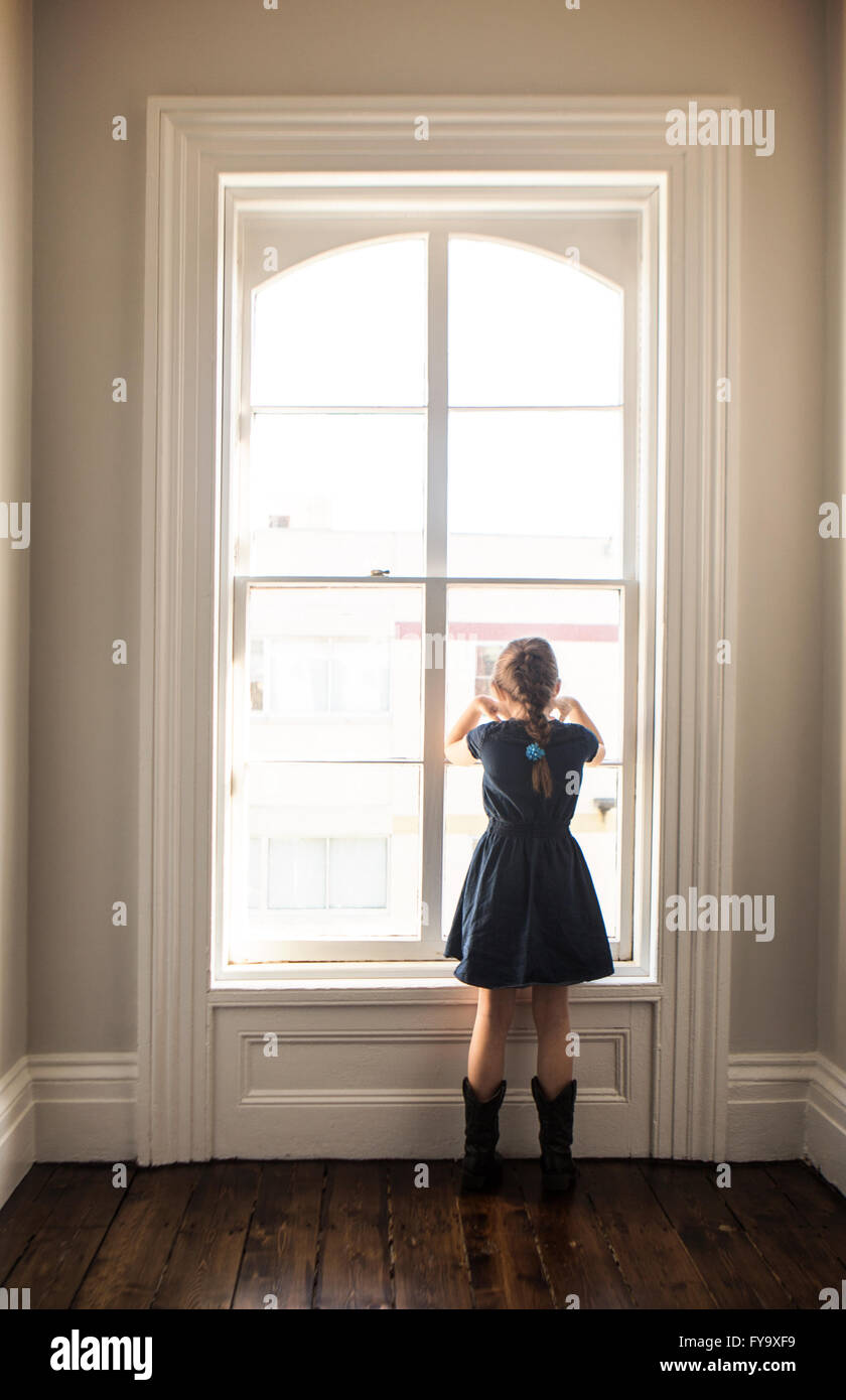 girl looking out window Stock Photo - Alamy