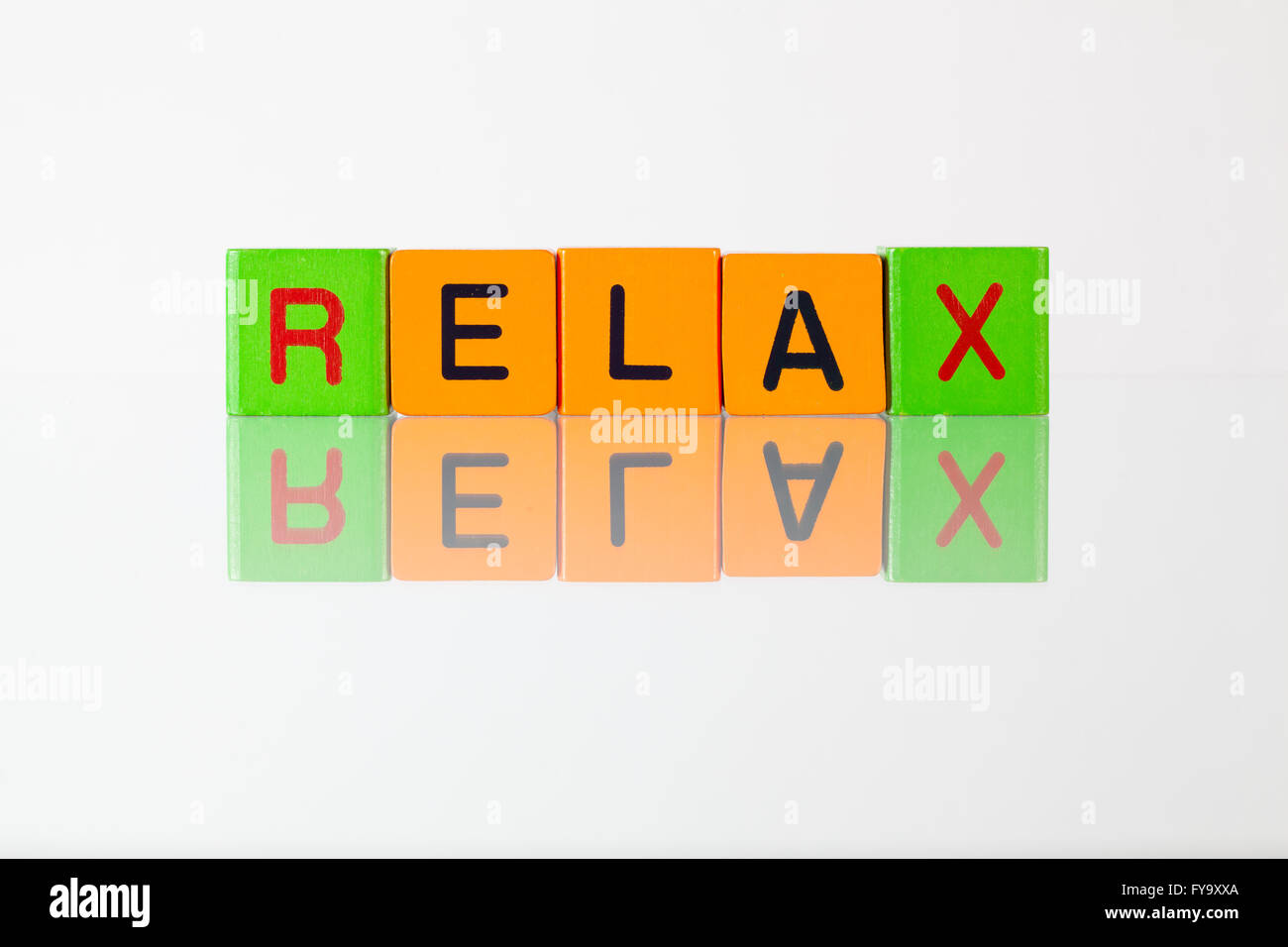 Relax - an inscription from children's wooden blocks Stock Photo - Alamy