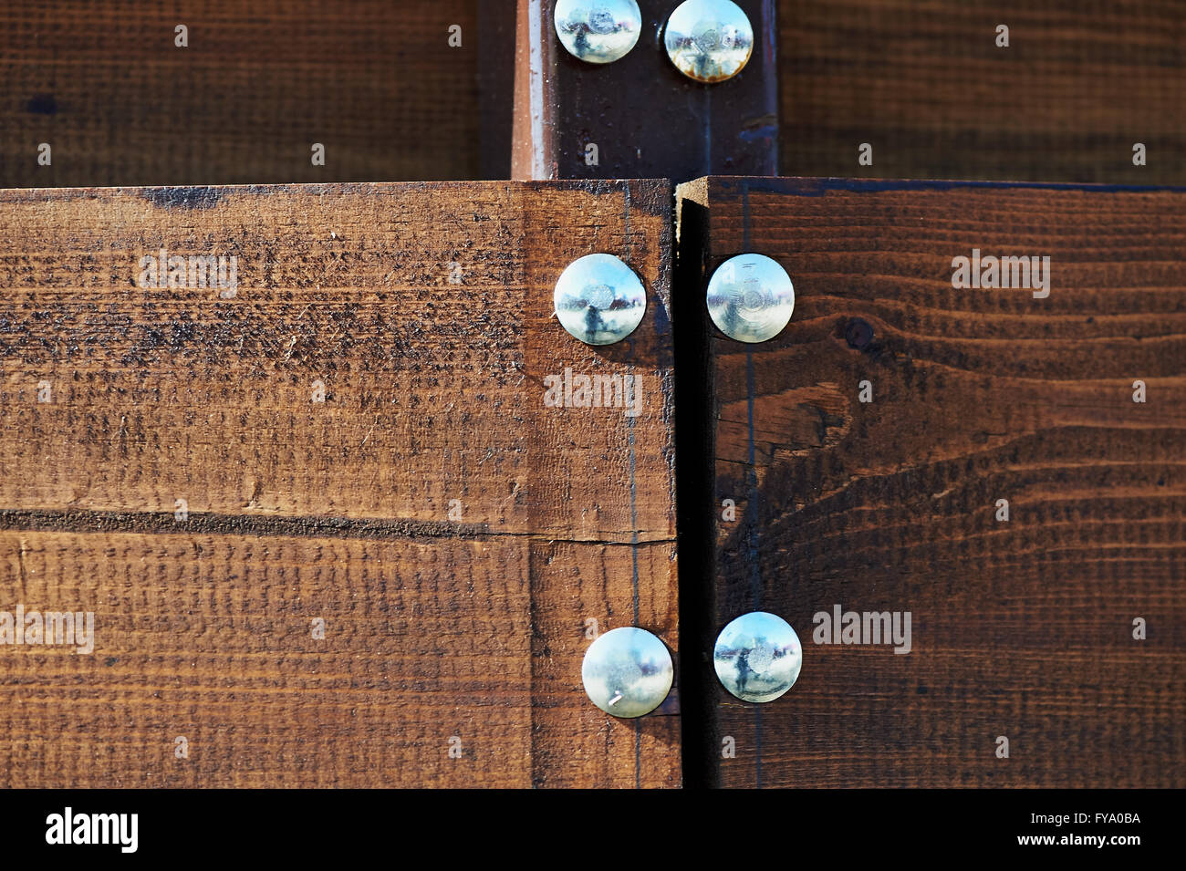 old wooden fence with iron rivets Stock Photo - Alamy