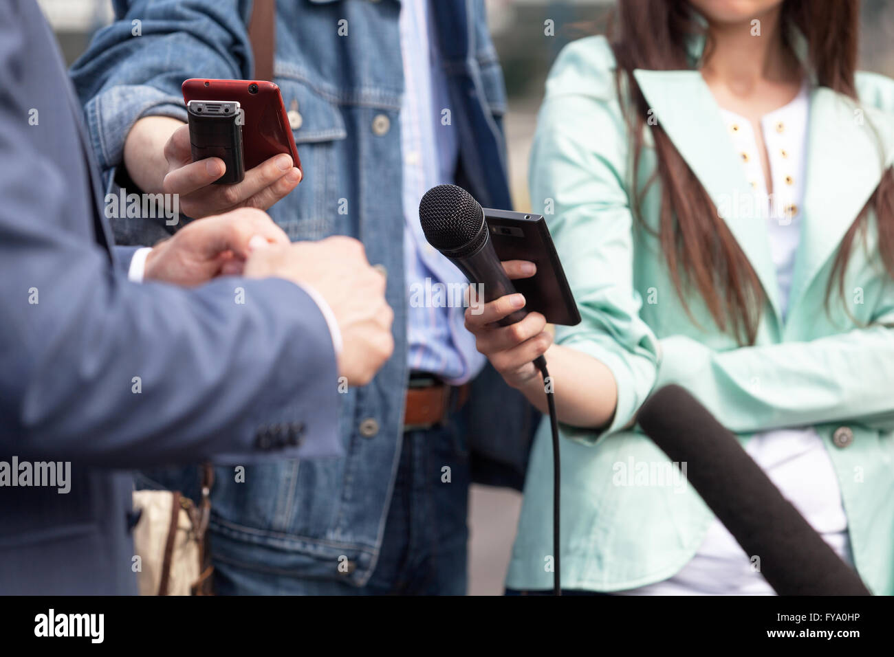 Journalists making interview with businessman or politician Stock Photo ...
