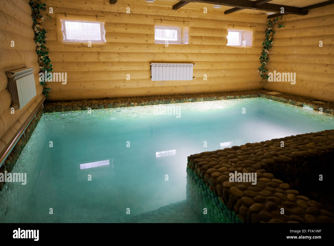 Beautiful and deep pool in a wooden sauna Stock Photo - Alamy