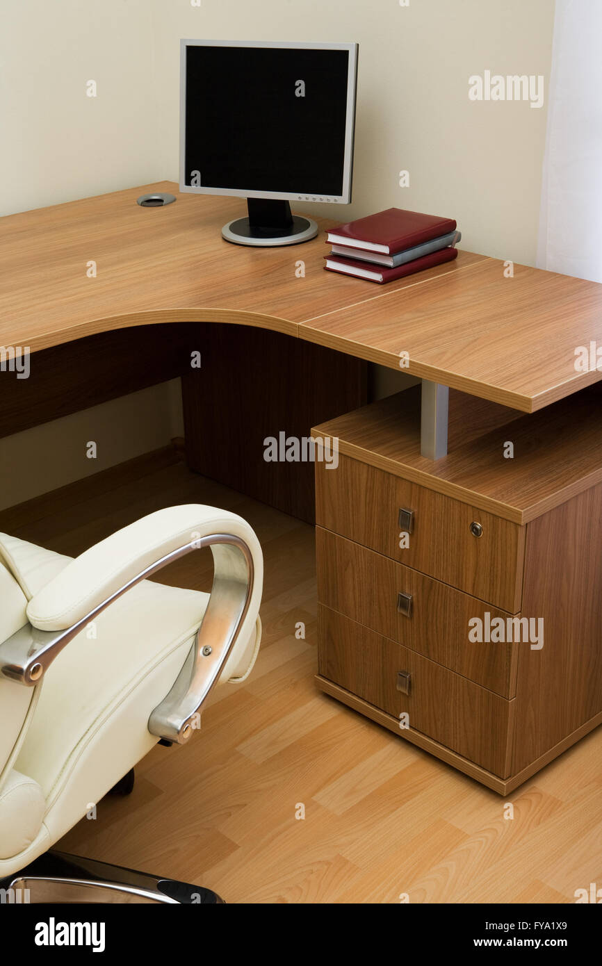 The monitor on a table at modern office Stock Photo - Alamy