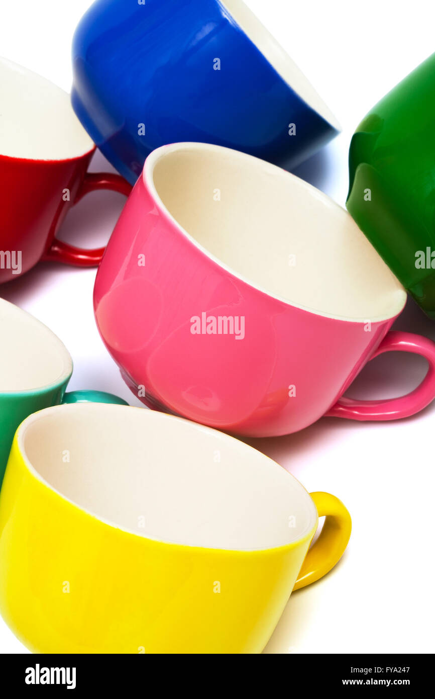 Beautiful color cups on a white background Stock Photo - Alamy