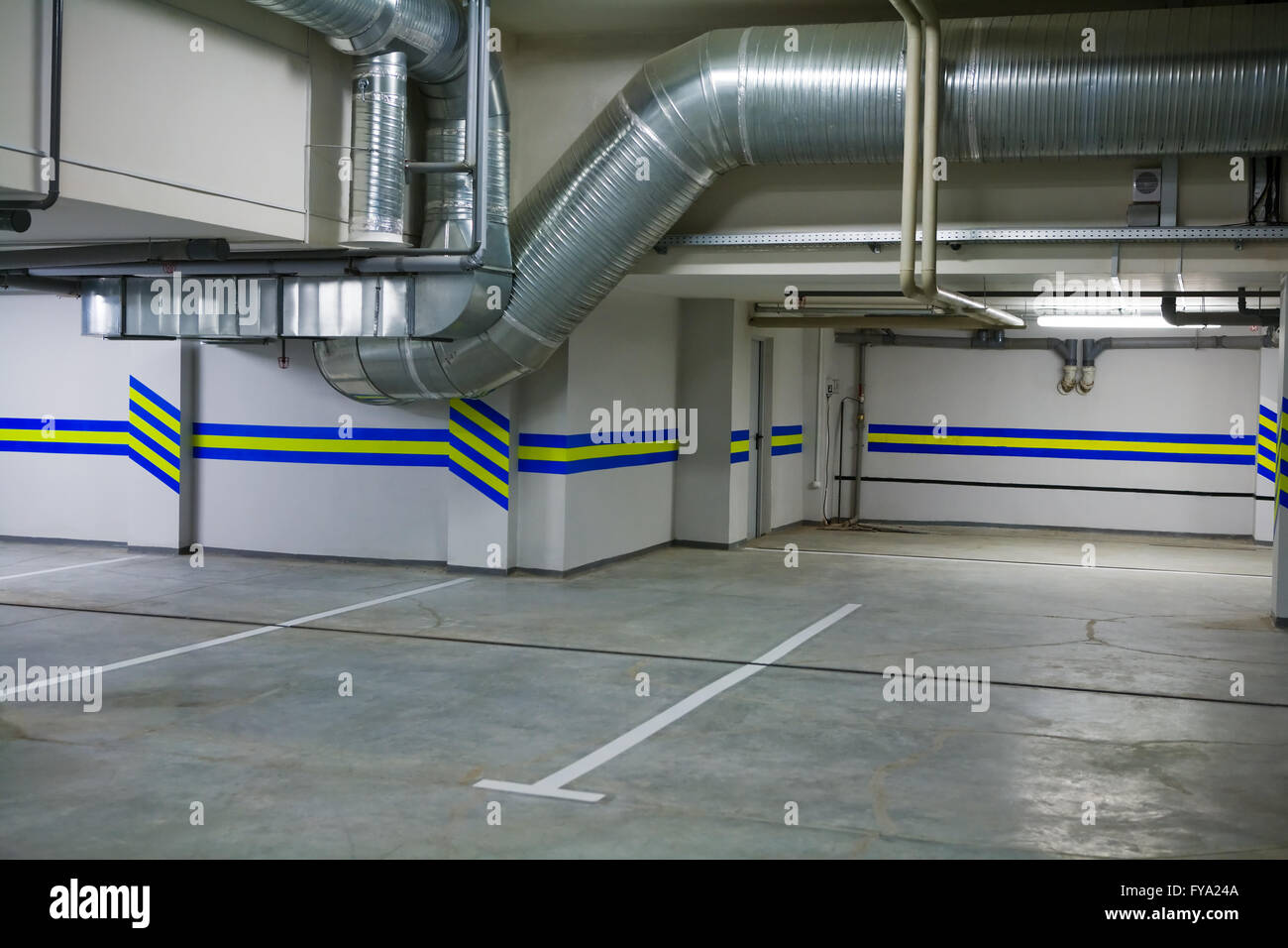 Parking in a cellar of a modern building Stock Photo - Alamy