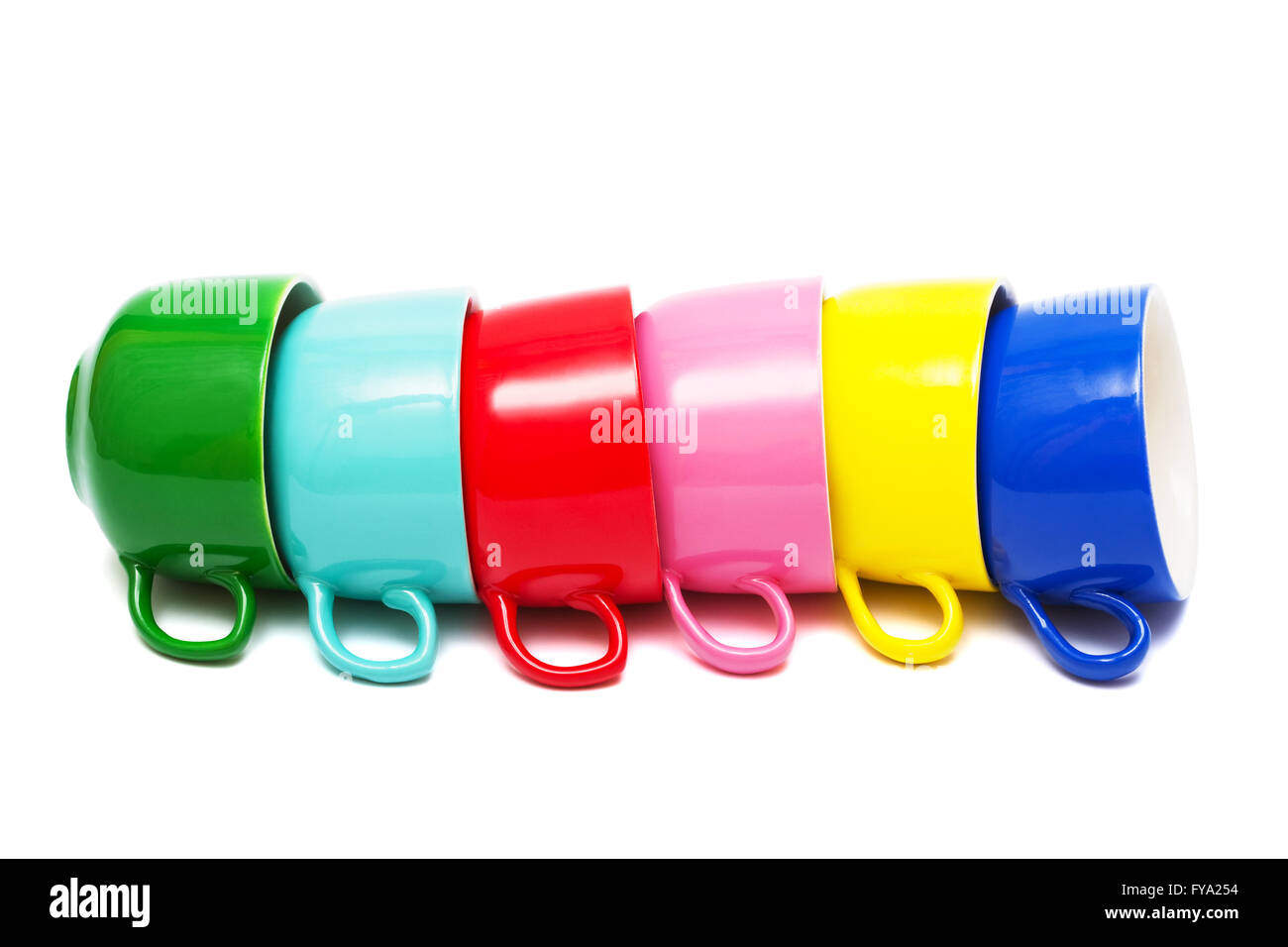 Beautiful color cups on a white background Stock Photo - Alamy