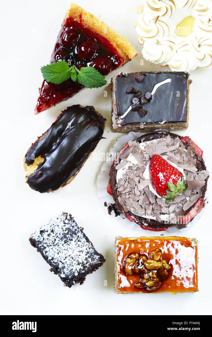 Assorted desserts, cakes and pastries on a white background Stock Photo ...