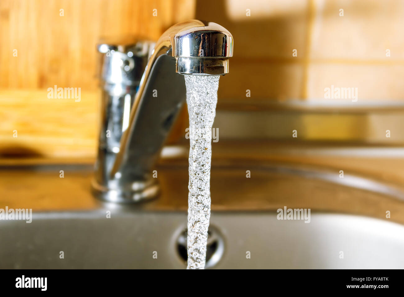 Chrome sink with modern design in kitchen Stock Photo - Alamy