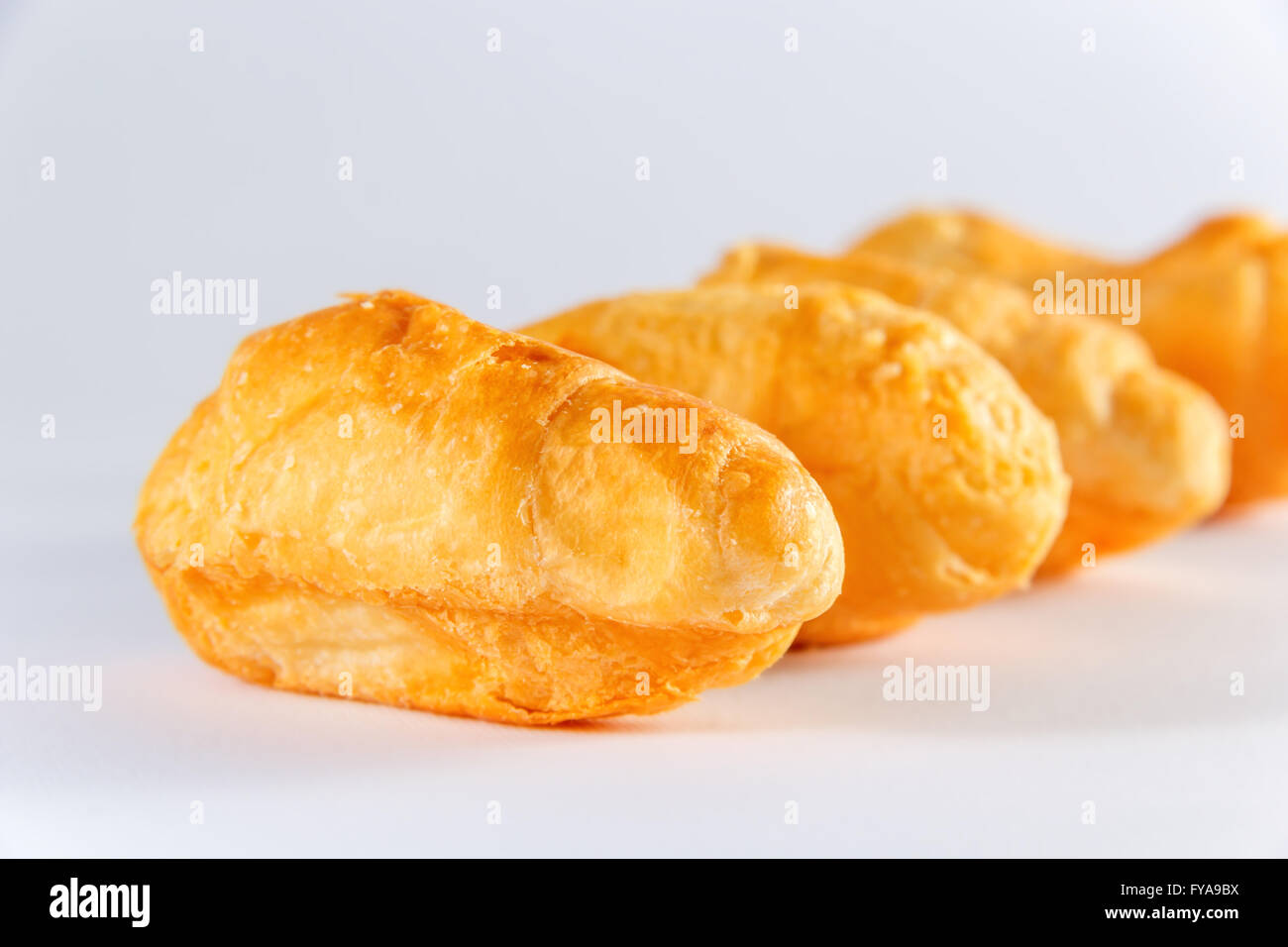 mini croissants in isolated background Stock Photo - Alamy