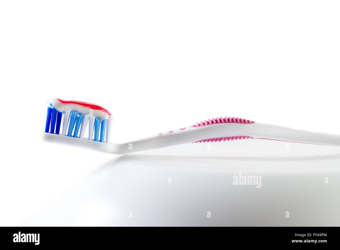 toothbrush with toothpaste in isolated white background Stock Photo - Alamy