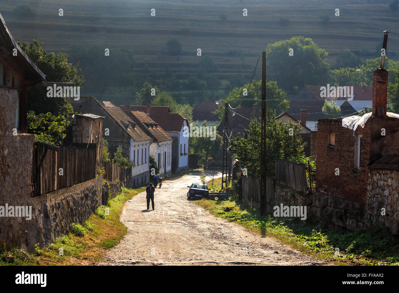 Tipical romanian village street view in backlight Stock Photo - Alamy