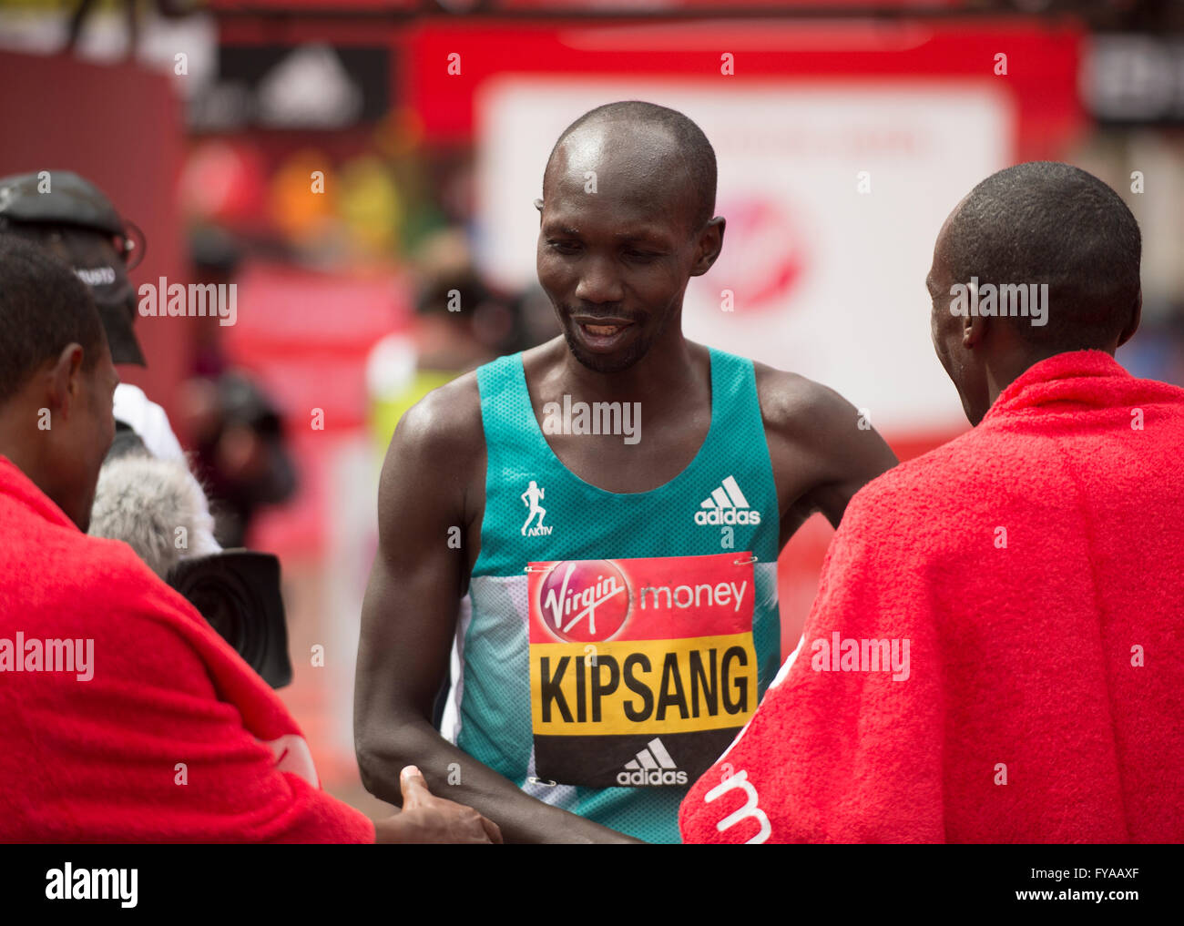 Wilson Kipsang of Kenya congratulates the top three elite men finishers ...