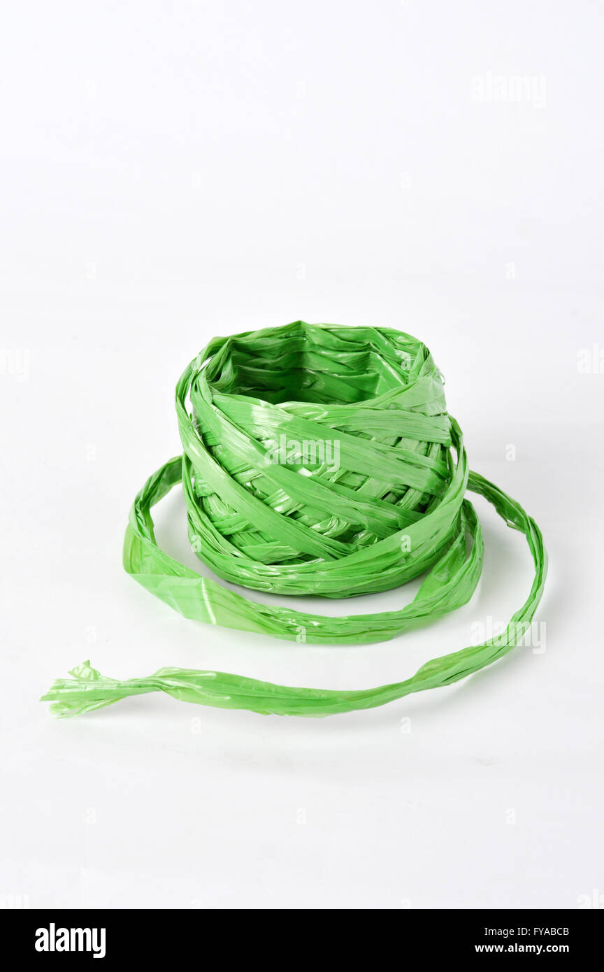 greenl plastic rope on the white background Stock Photo - Alamy