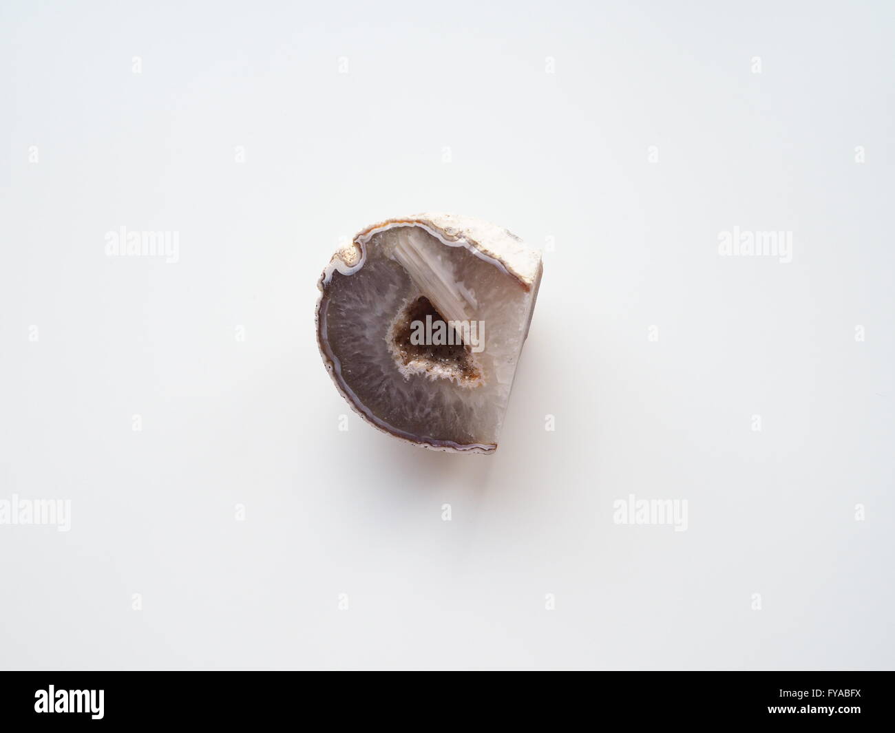 Stone cut in half. Golden and see through Stock Photo - Alamy