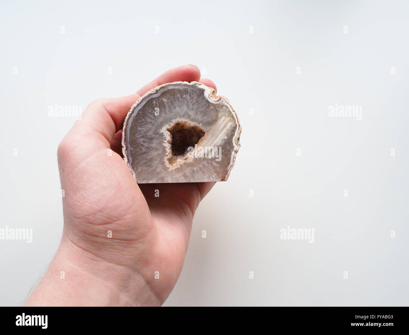 Stone cut in half. Golden and see through Stock Photo - Alamy