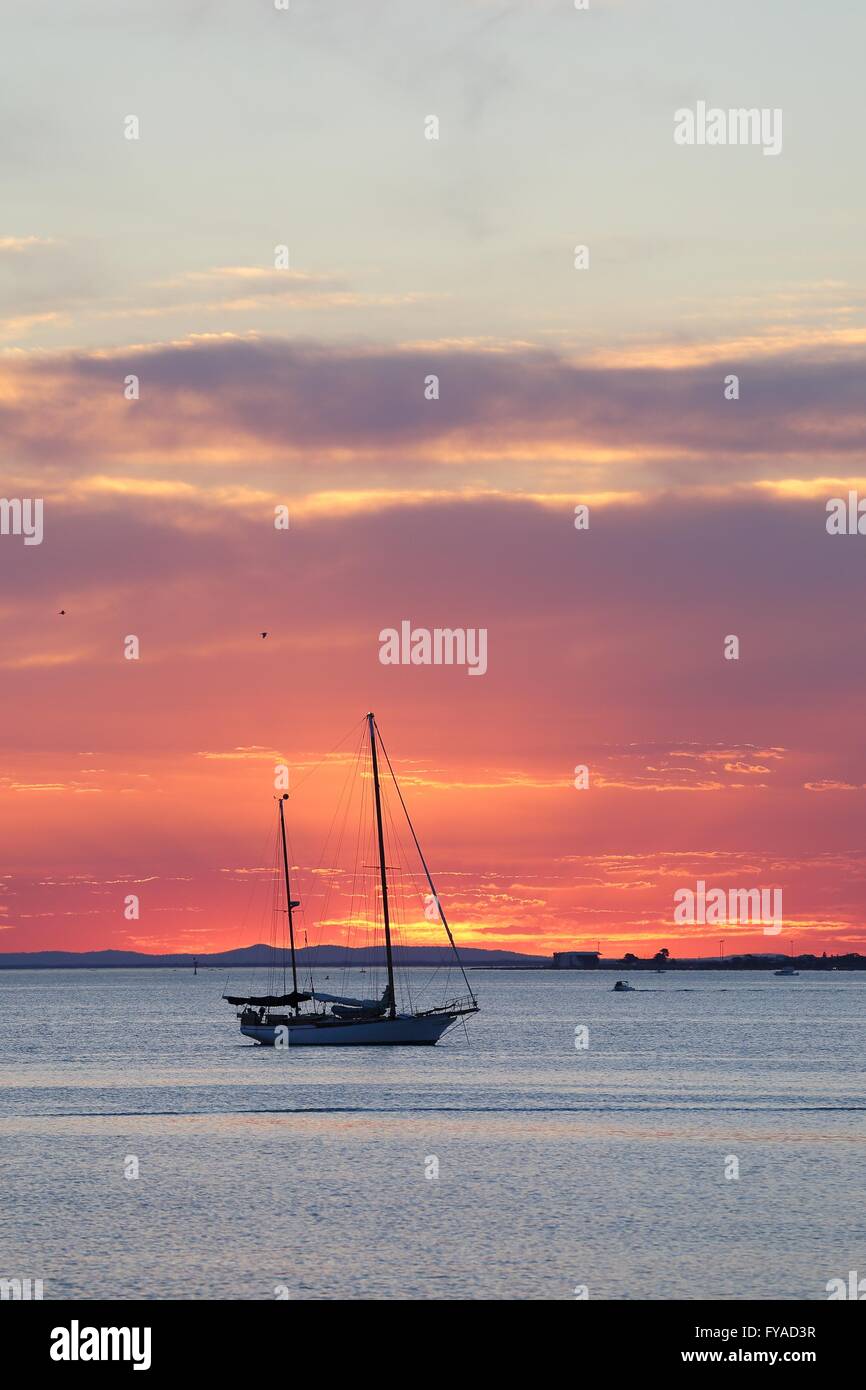 Sailing at sunset Stock Photo - Alamy
