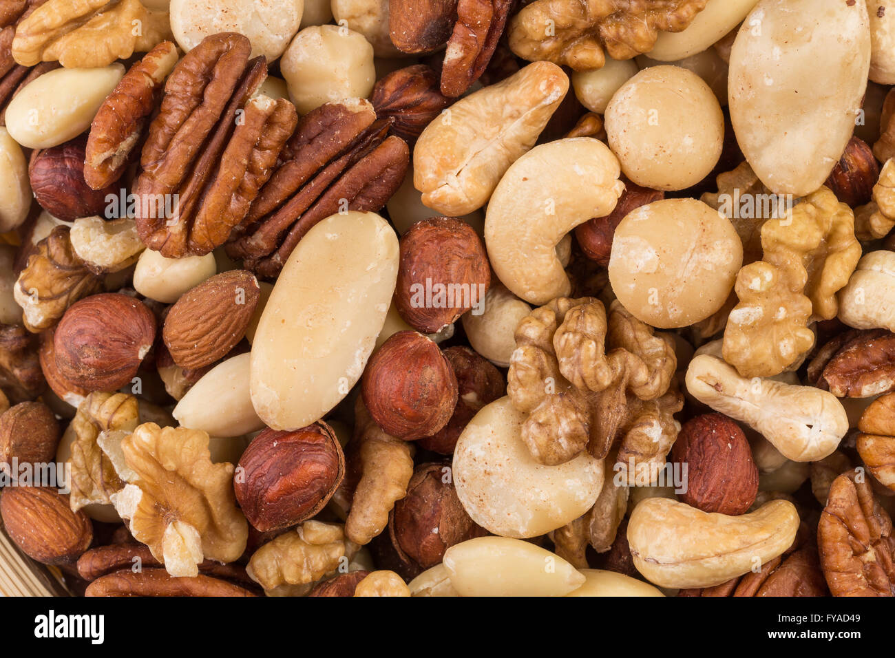 lot of different types of nuts mix for background Stock Photo - Alamy