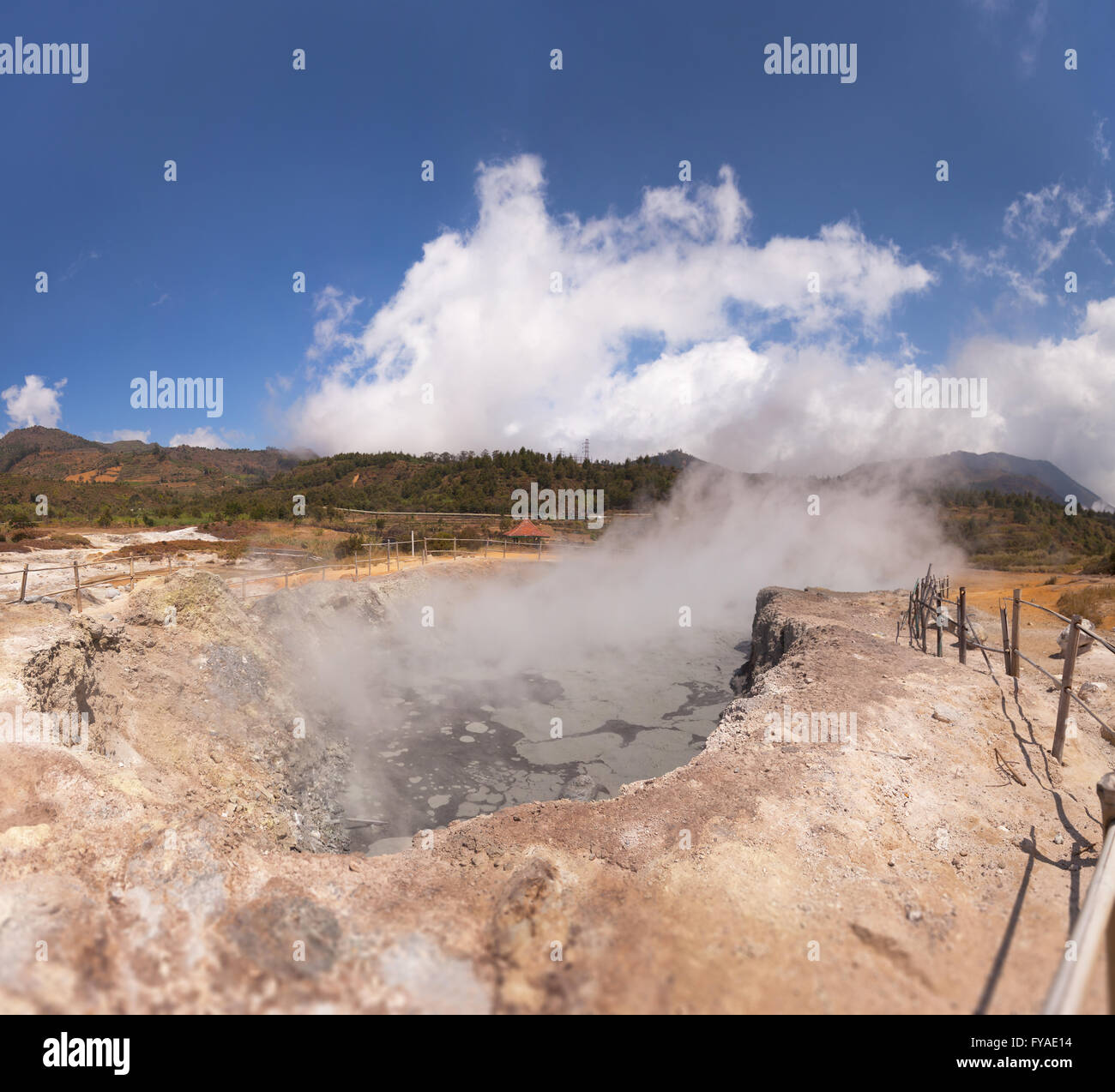 Steam rises from a natural, geothermally heated geyser in Java ...