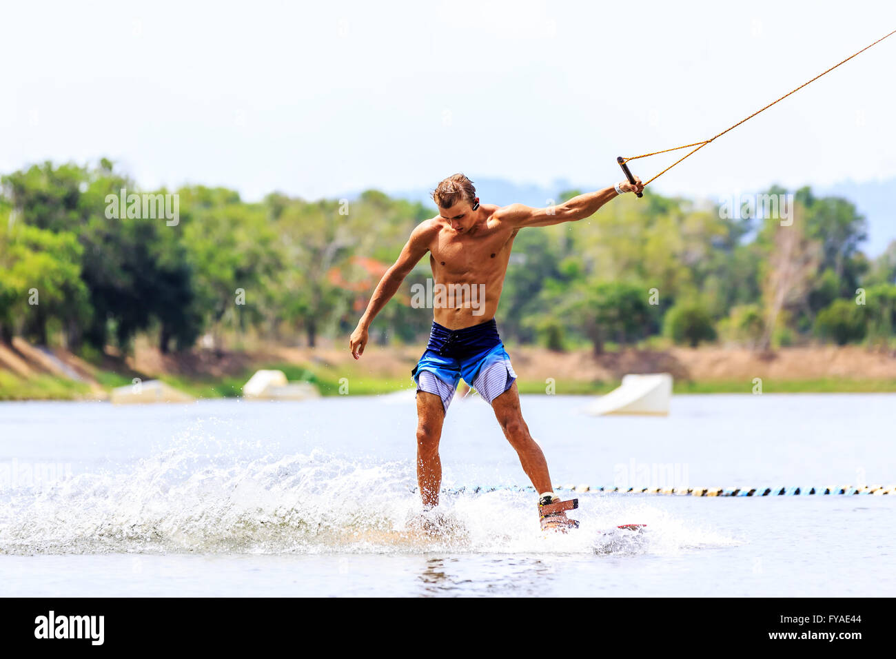 Man Wakeboarding in action. Phuket, Thailand Stock Photo - Alamy