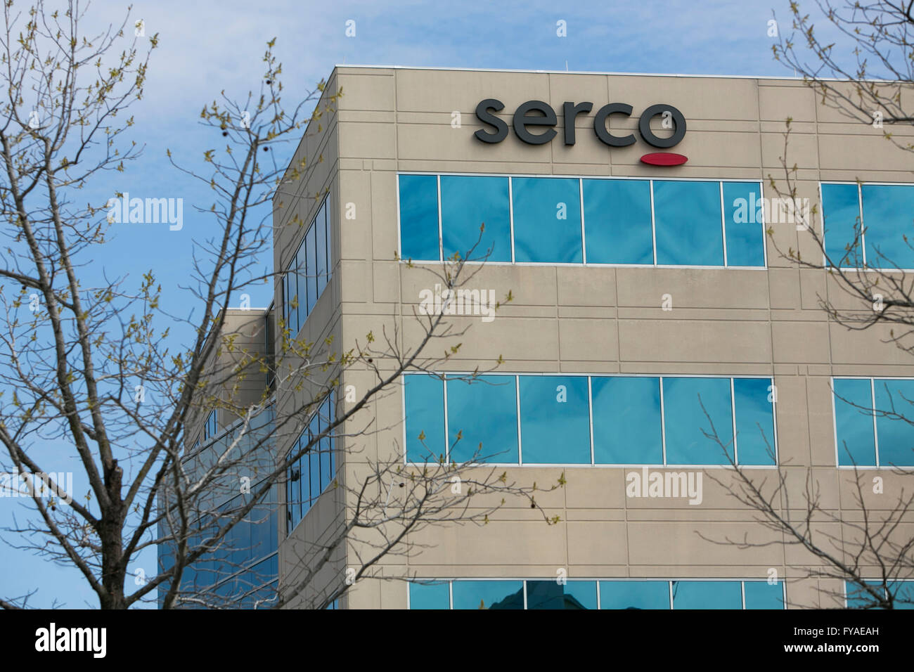 A logo sign outside of a facility occupied by Serco in Columbia ...