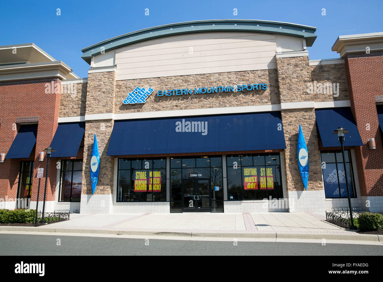 A logo sign outside of an Eastern Mountain Sports retail store in ...