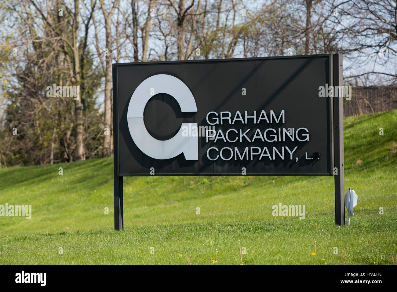 A logo sign outside of a facility occupied by the Graham Packaging ...