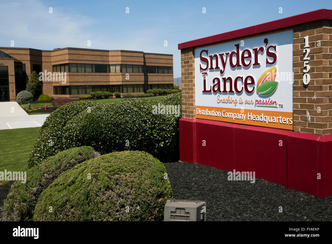 A logo sign outside of the distribution headquarters of Snyder's-Lance ...