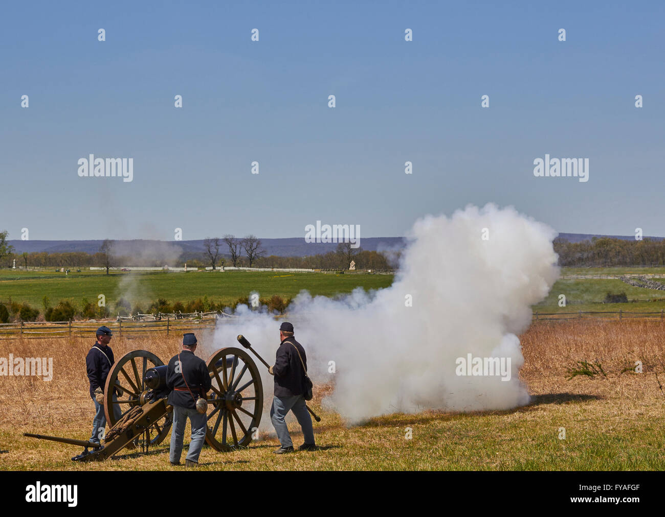 American Civil War reenactors firing a cannon at Gettysburg National ...